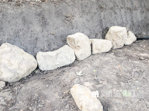 How to Build a Simple Stone Retaining Wall for Free | Sunnyside Home