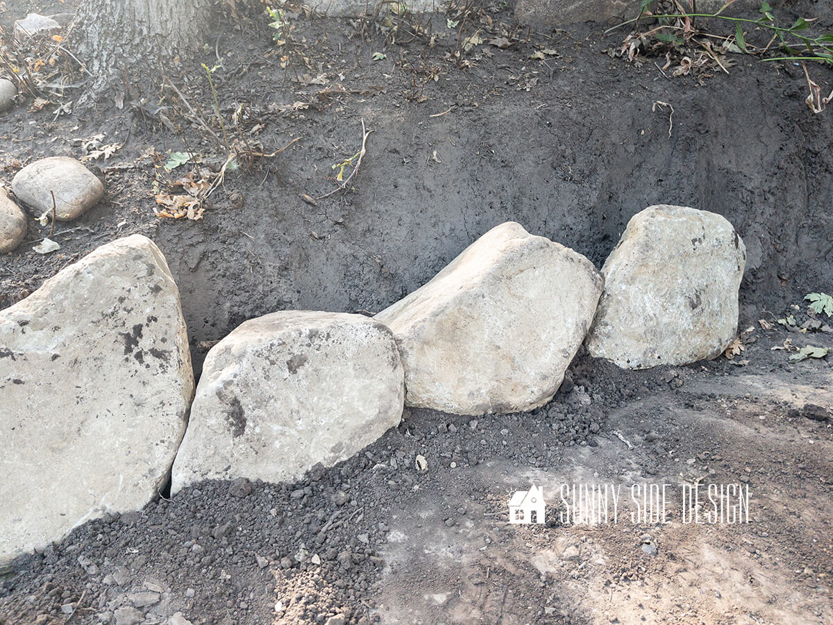 How to Build a Simple Stone Retaining Wall for Free | Sunnyside Home