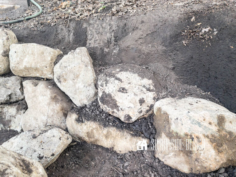 How to Build a Simple Stone Retaining Wall for Free | Sunnyside Home